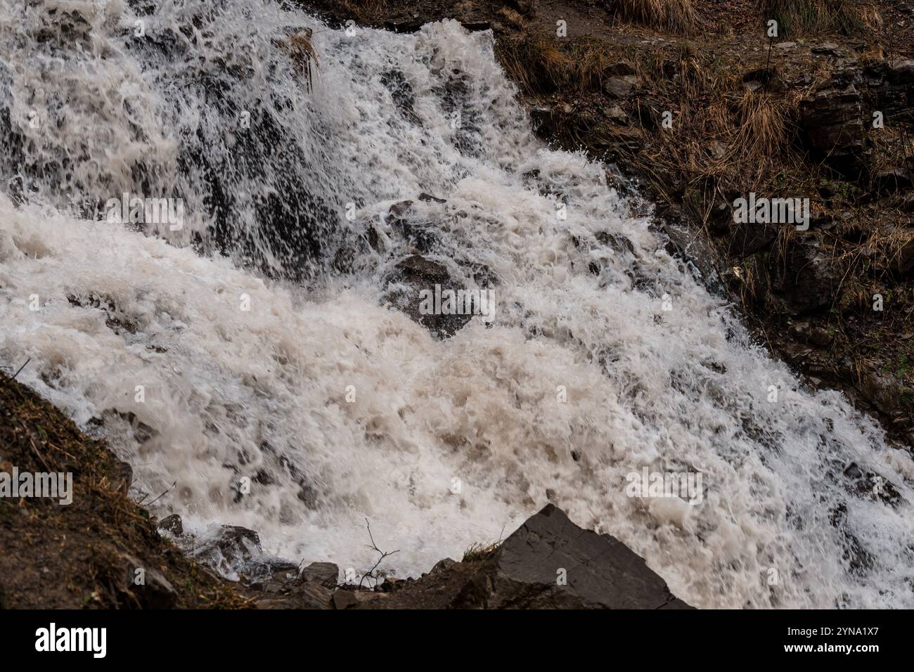 Rushing Cascade of White Water Over Rocky Terrain in a Natural ...