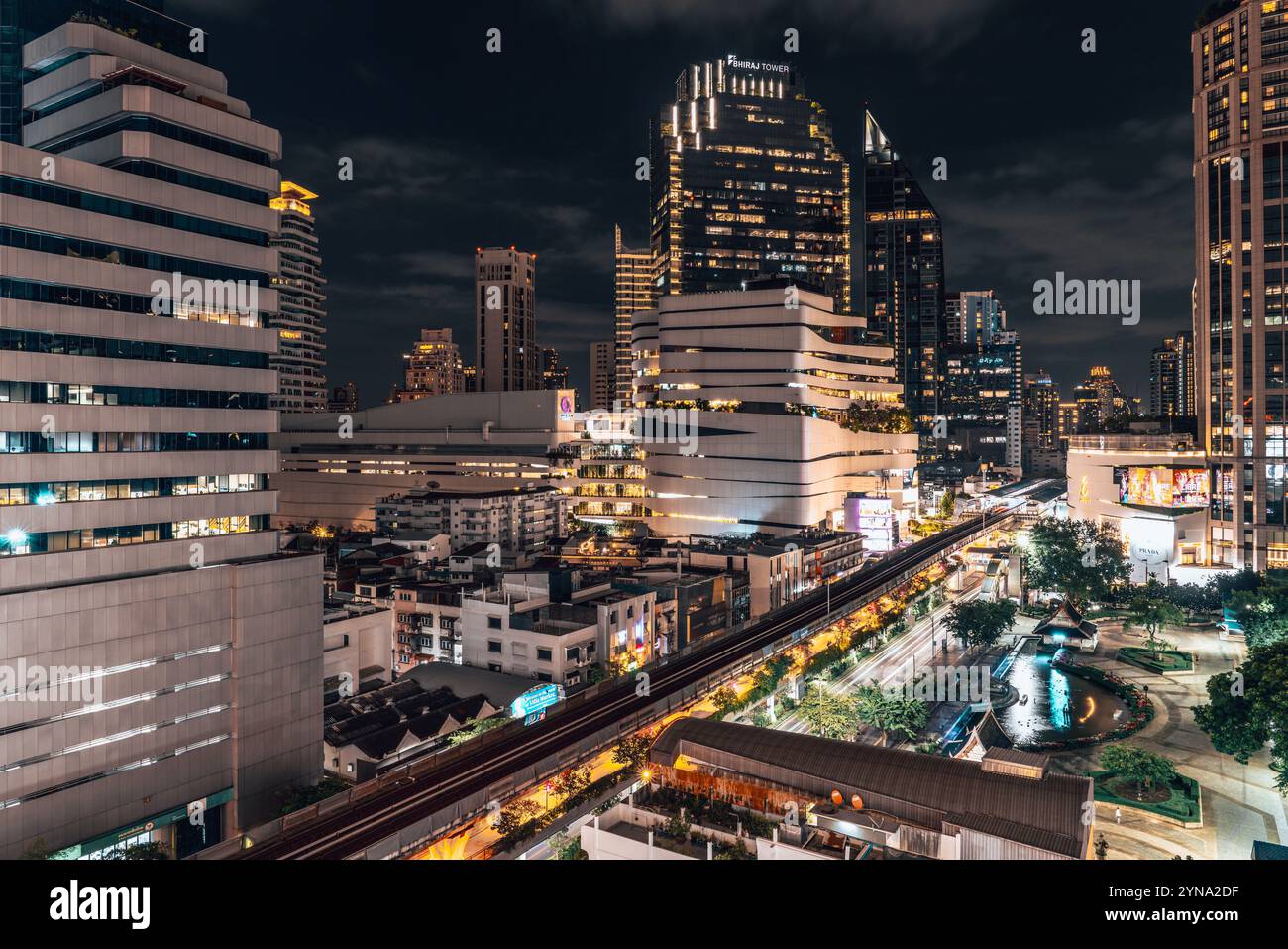 A nighttime view of Bangkok's vibrant urban landscape, with illuminated ...