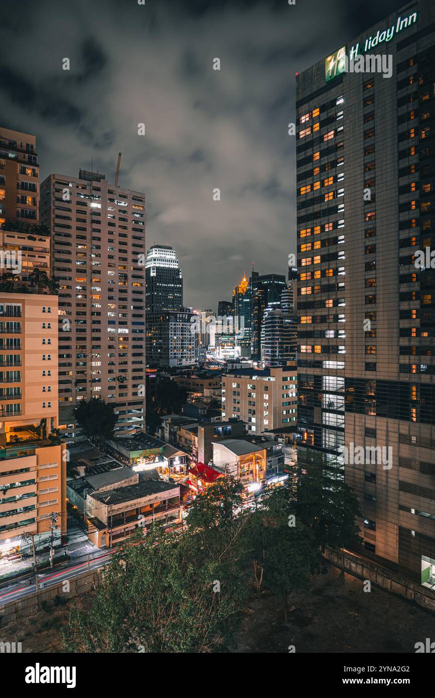 A nighttime view of Bangkok's vibrant urban landscape, with illuminated ...