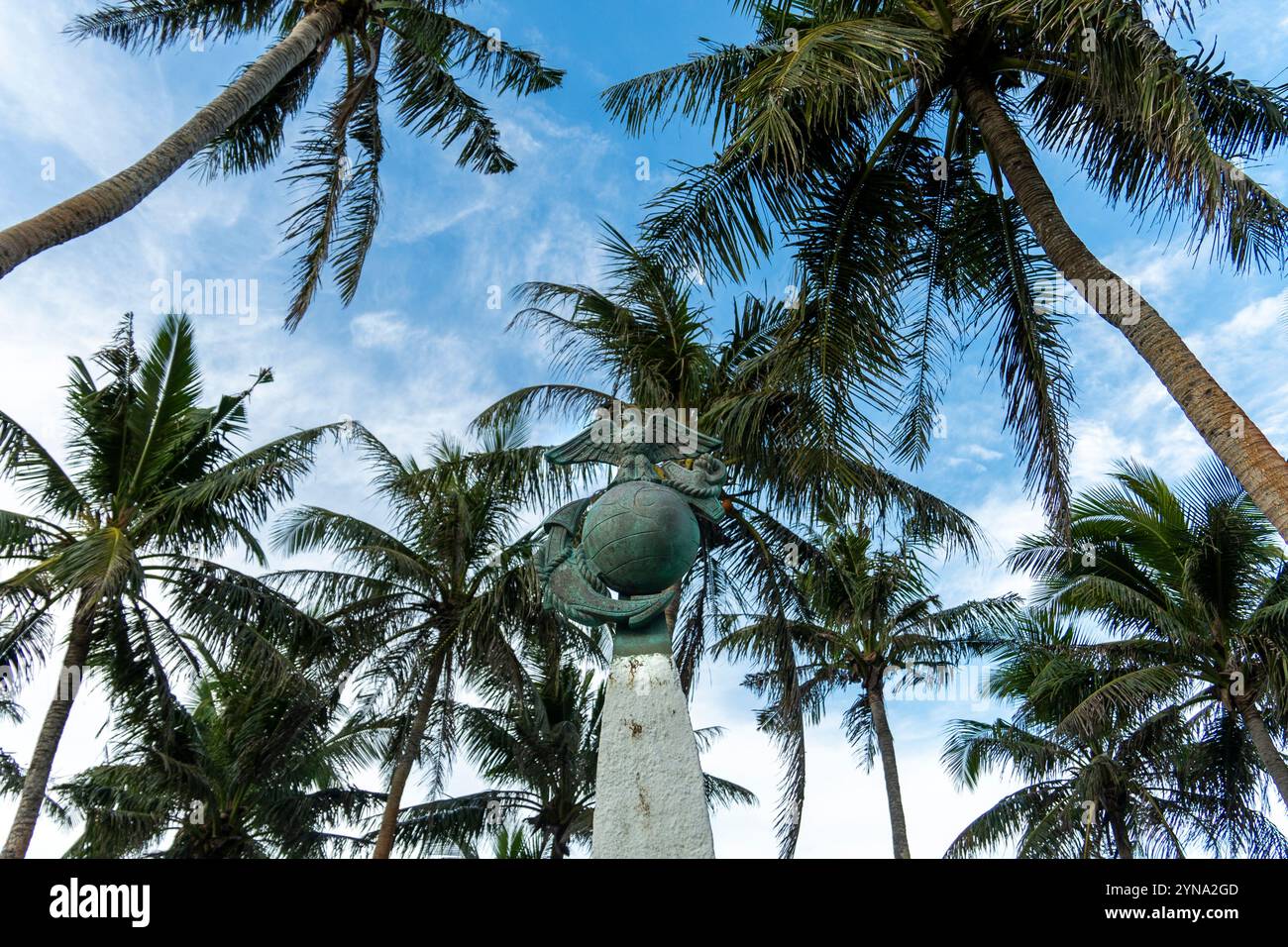 Statue under palm trees in Guam showcasing the island's natural beauty ...