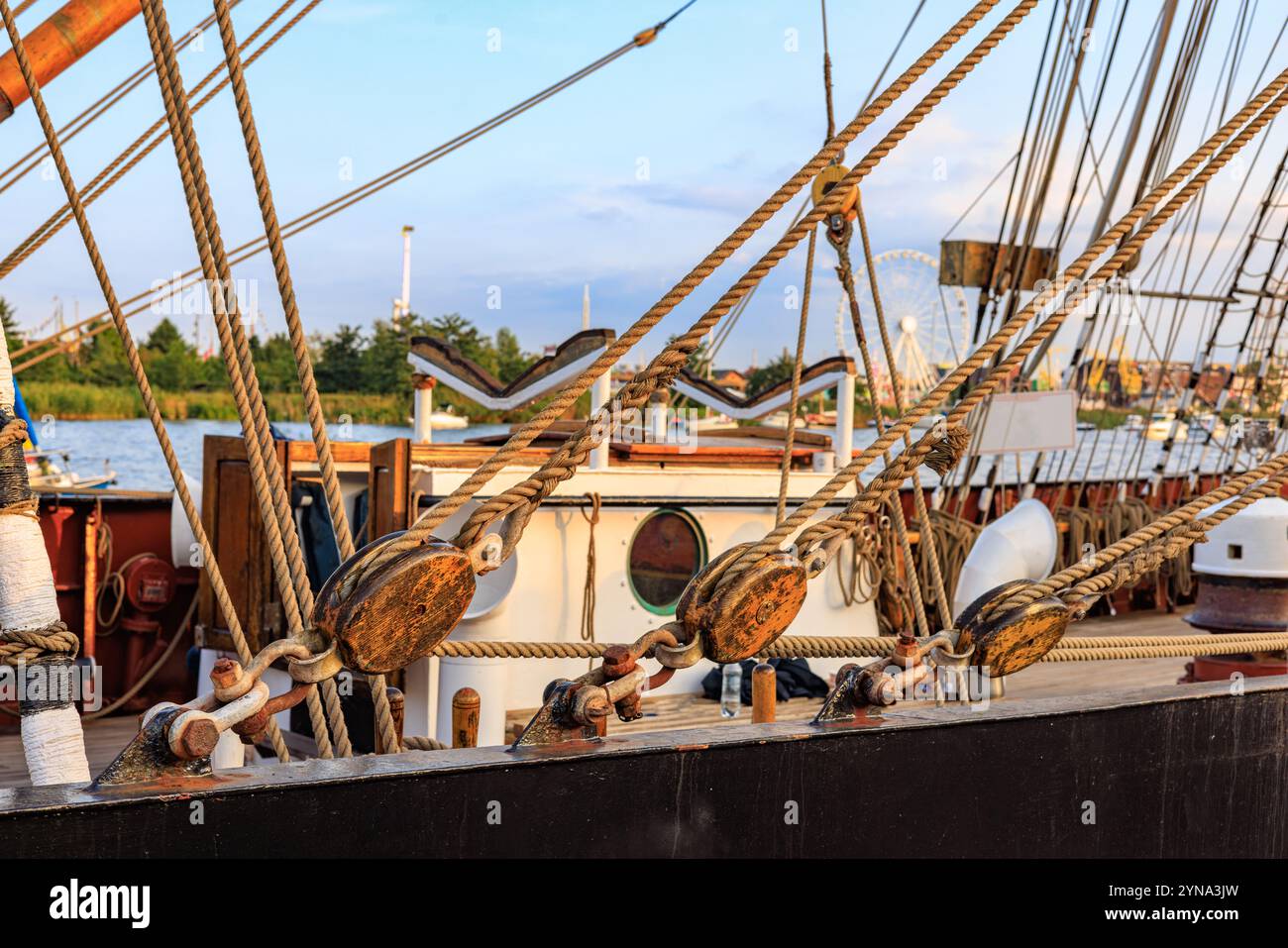 Three pulleys with ropes on board a sailing vessel Stock Photo - Alamy