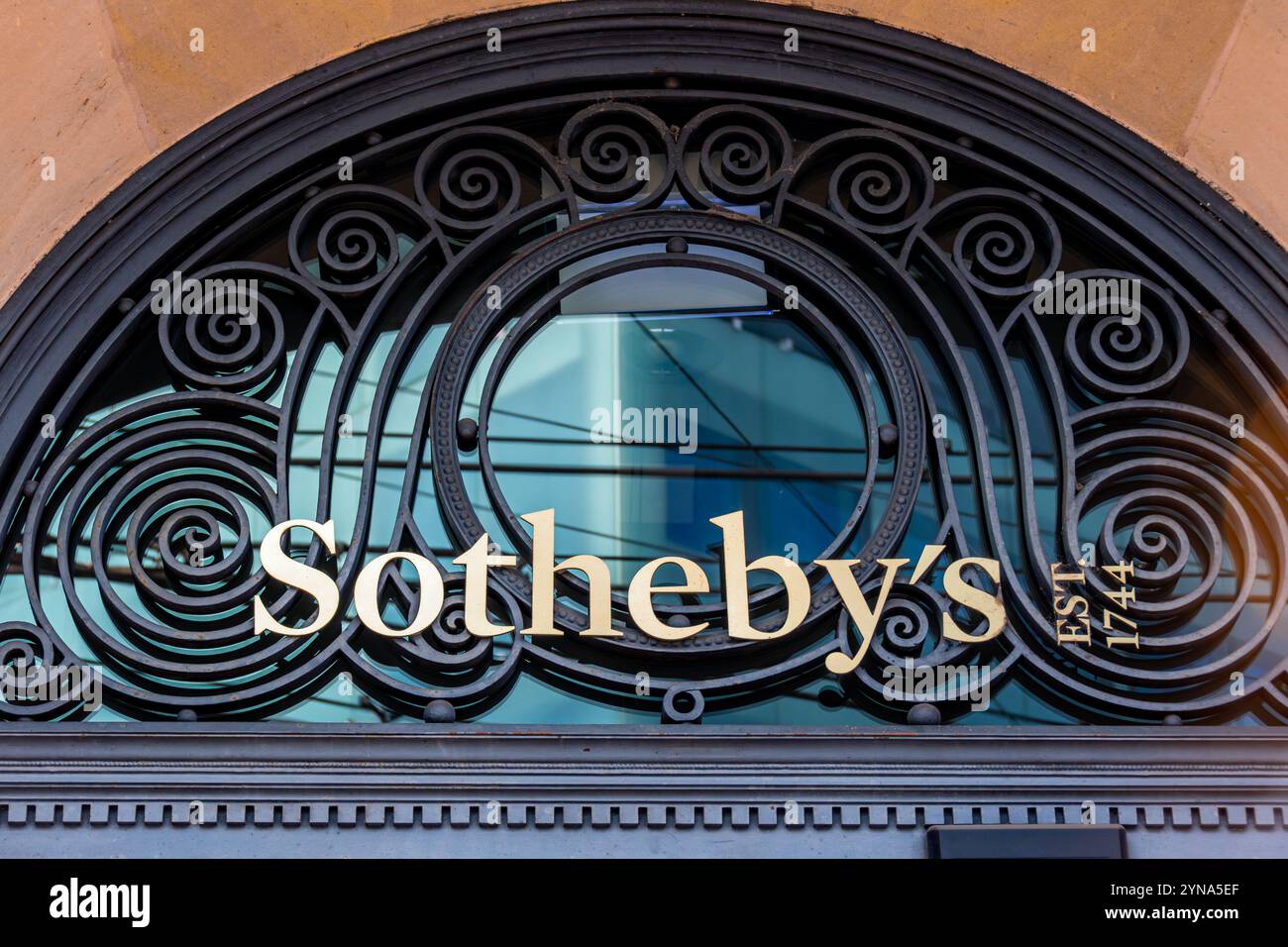 Sign and logo at the entrance to the Sotheby's building in Geneva ...