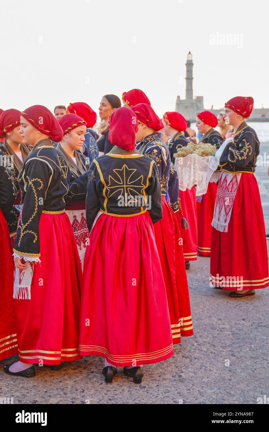 Greece, Crete, Traditionally dressed Greek women carrying gifts during ...