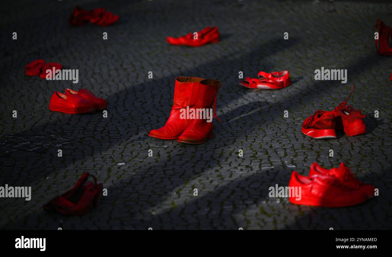Berlin, Germany. 25th Nov, 2024. Red shoes are placed at Tiergarten ...