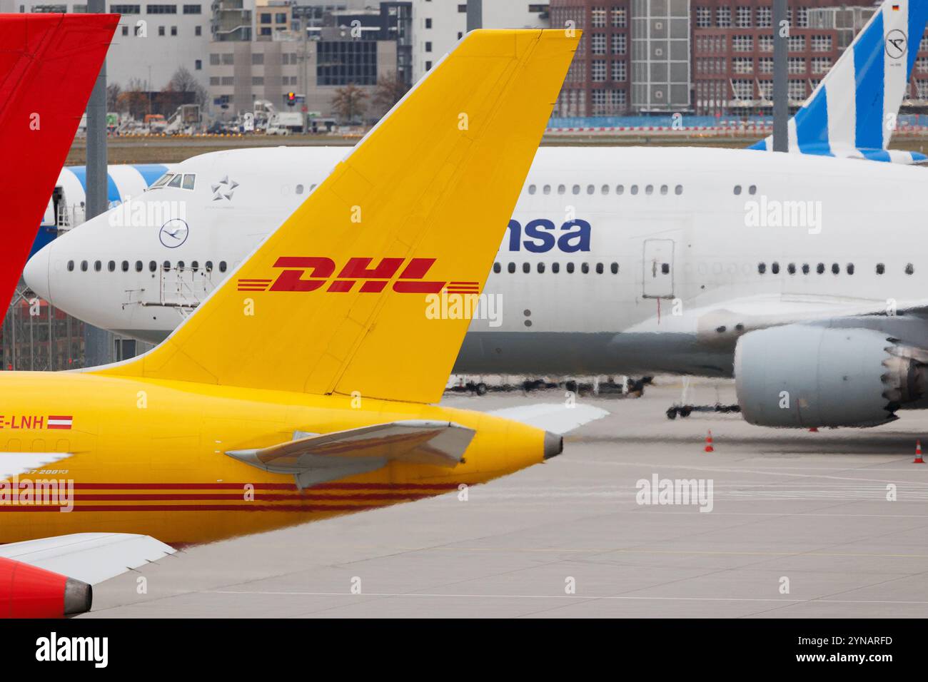 25 November 2024, Hesse, Frankfurt/M.: View of the tail of a DHL ...
