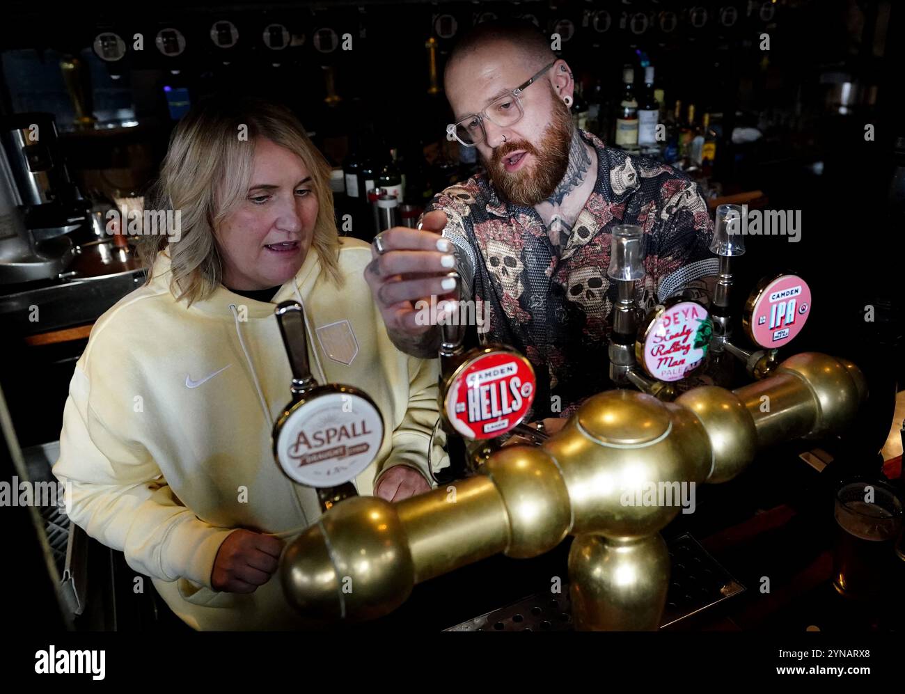 USA Women's head coach Emma Hayes pulls a pint behind the bar at The ...
