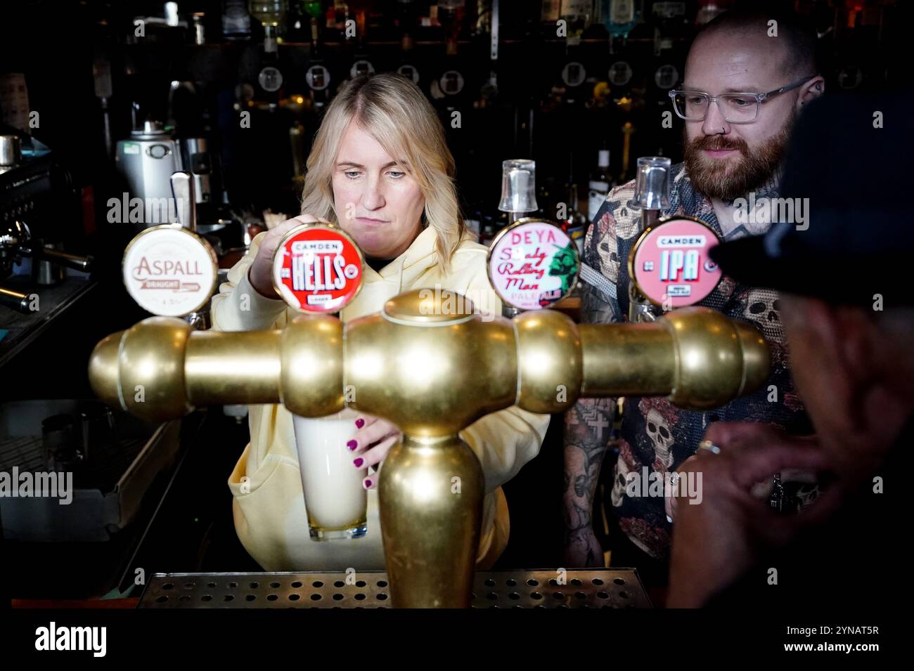 USA Women's head coach Emma Hayes pulls a pint behind the bar at The ...