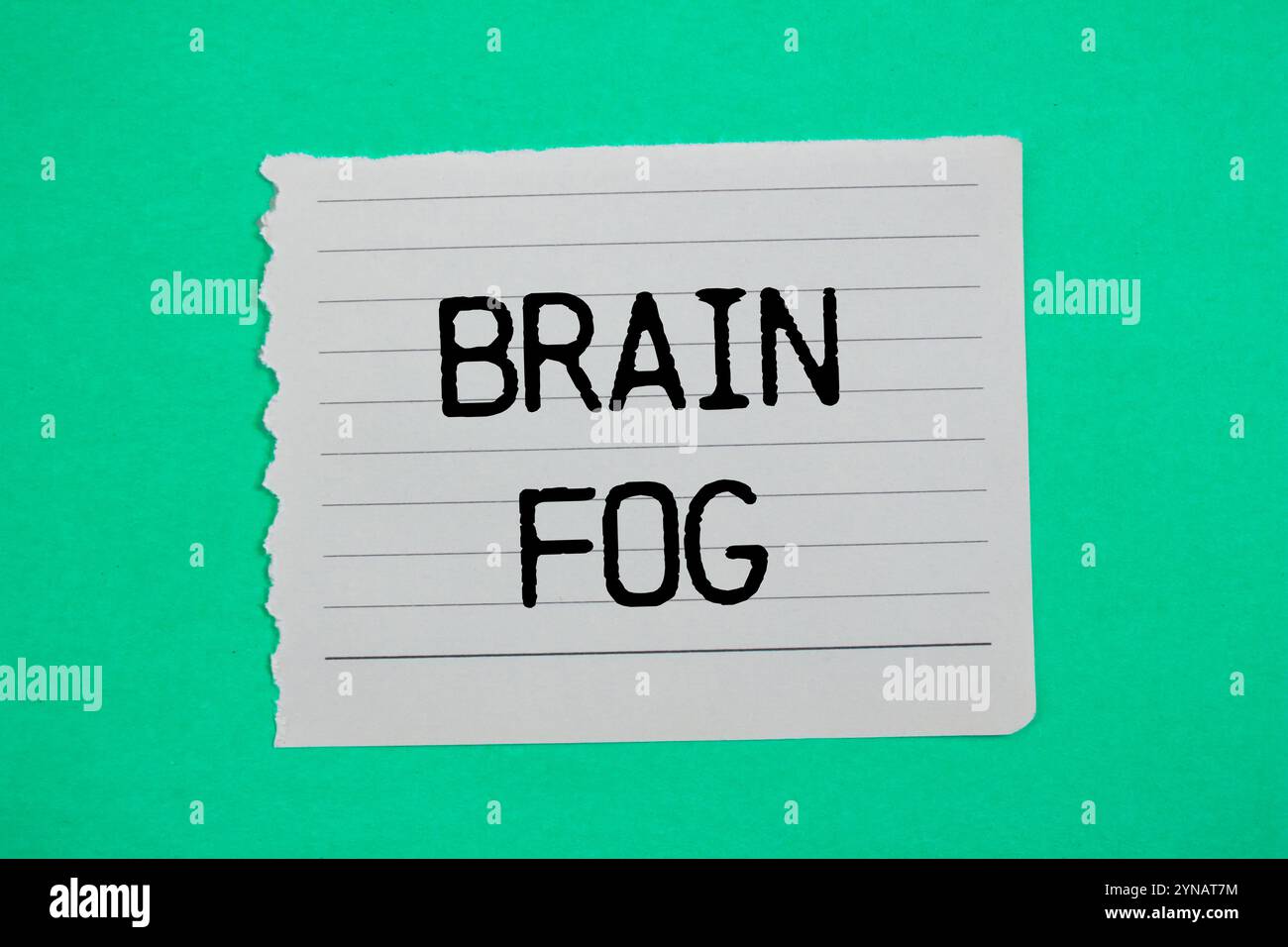 Brain fog message written on ripped torn paper piece with green ...