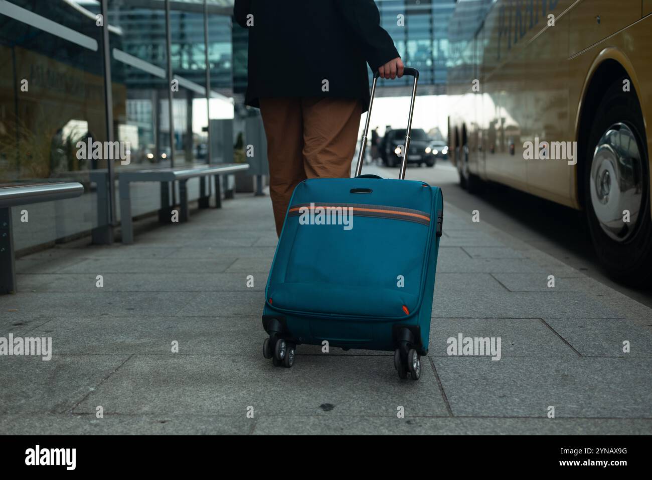 Airport Terminal. Woman in casual clothing walks through an airport ...