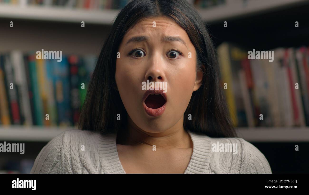 Close-up surprised young asian woman in shock with frightened ...