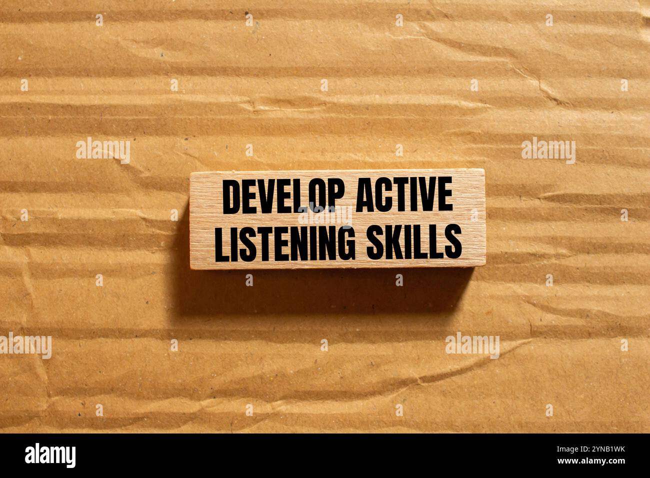 Develop active listening skills message written on wooden block with ...