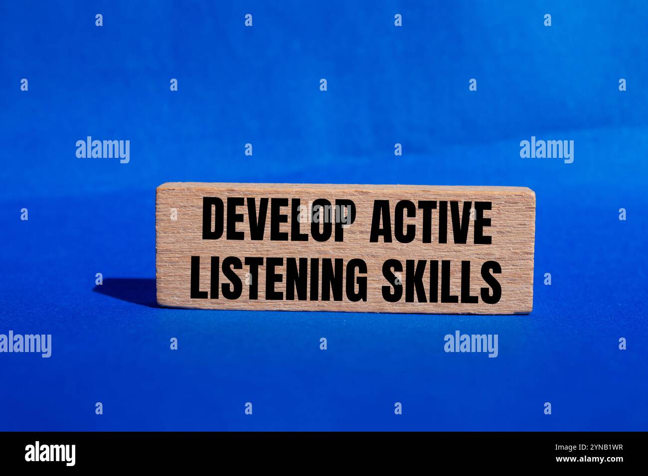 Develop active listening skills message written on wooden block with ...