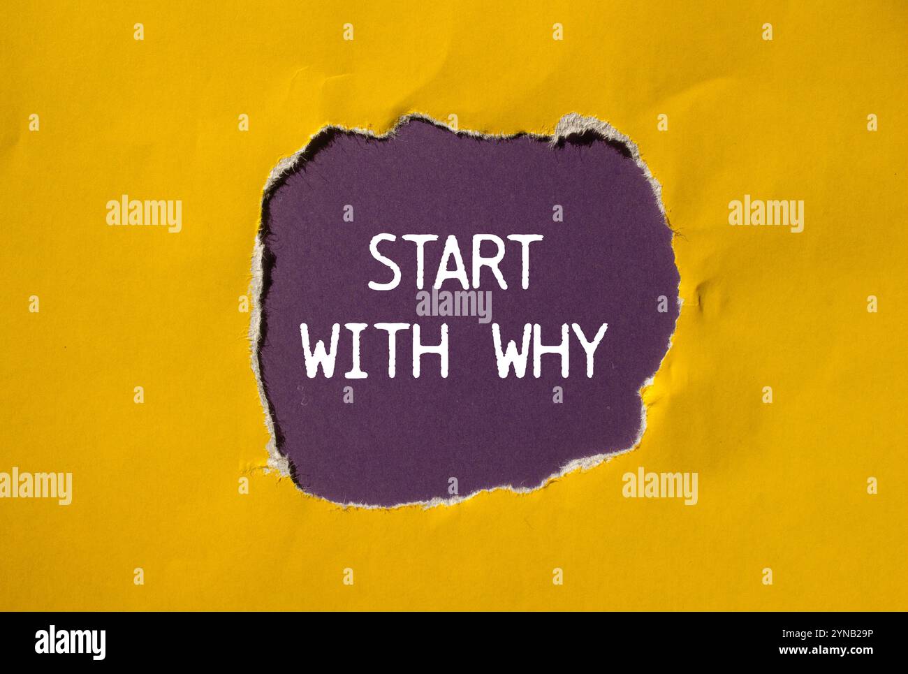 Start with why message written on ripped torn yellow paper with purple background. Conceptual ...