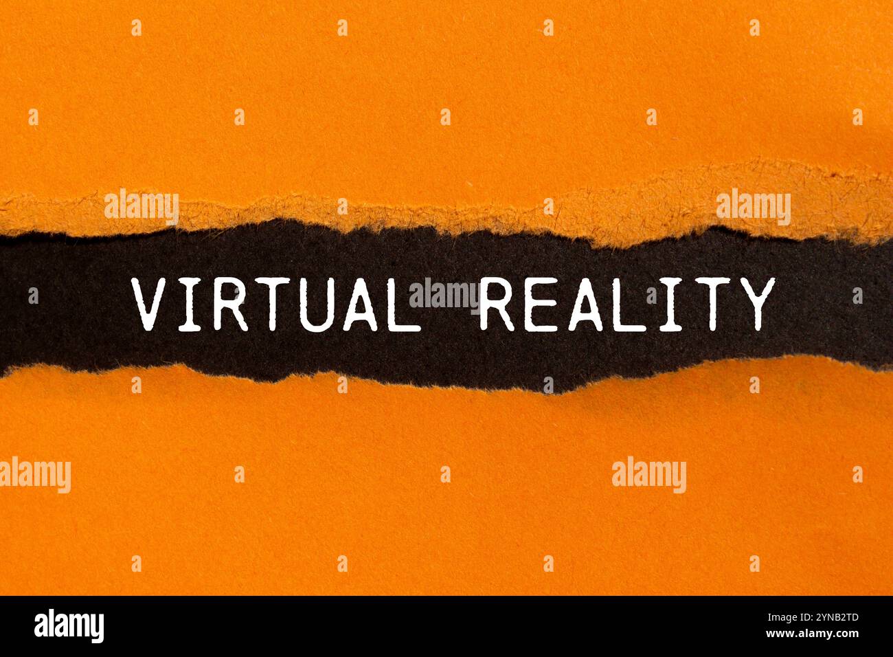 Virtual reality message written on ripped torn orange paper with black ...