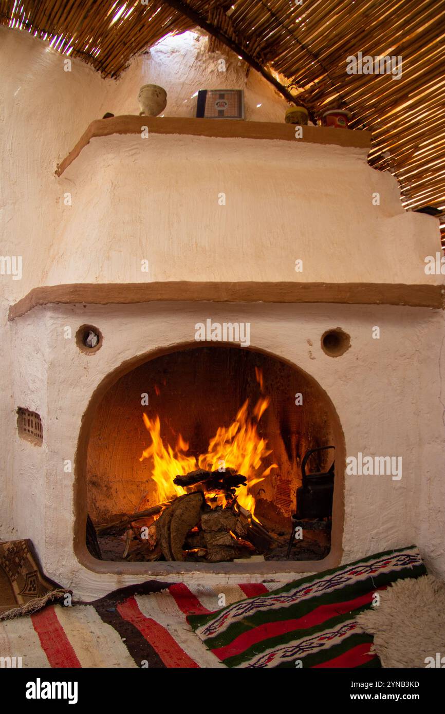 Lighting a fire inside fireplace traditional chimney at home Stock ...
