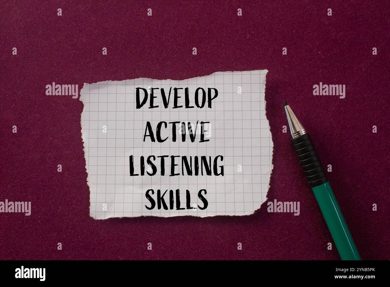 Develop active listening skills message written on ripped torn paper ...