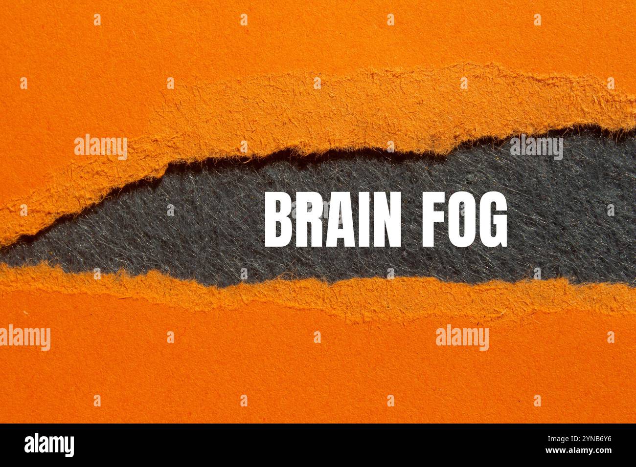 Brain fog message written on ripped torn orange paper with gray ...