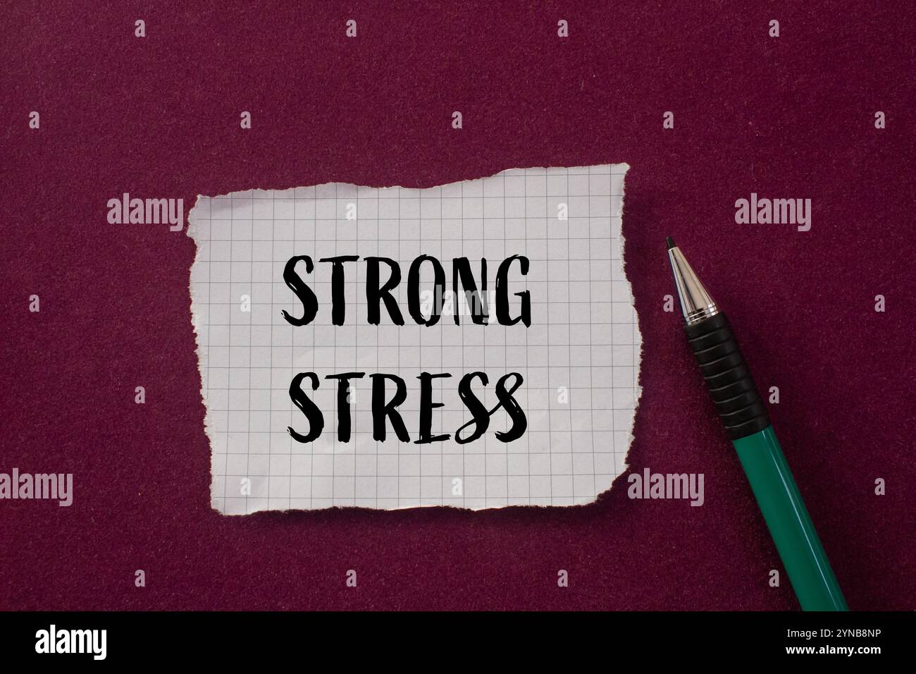 Strong stress message written on ripped torn paper piece with purple ...