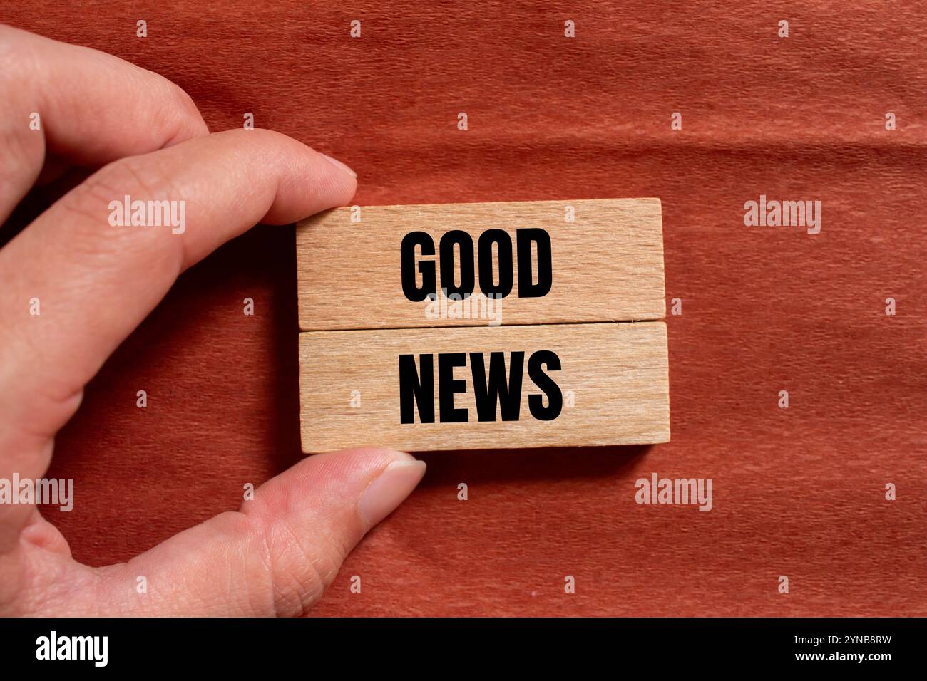 Good news message written on wooden blocks with brown background ...