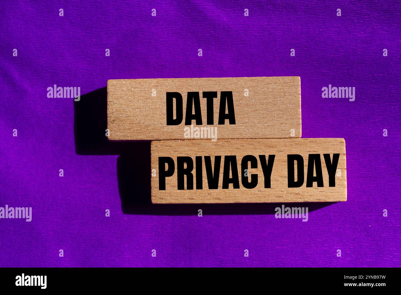 Data privacy day message written on wooden blocks with purple ...