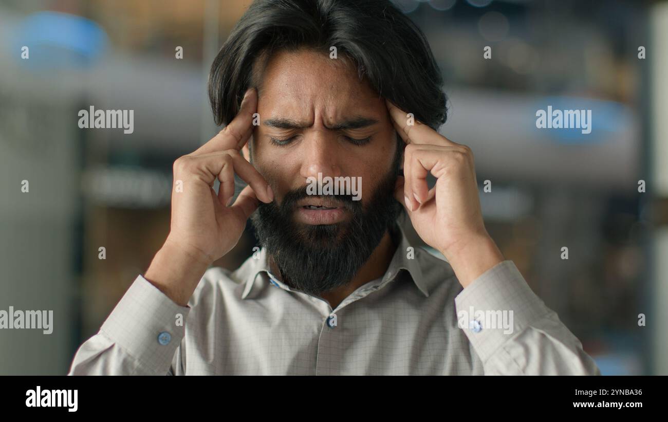 Stressed frustrated Indian man in underground parking lot suffering ...