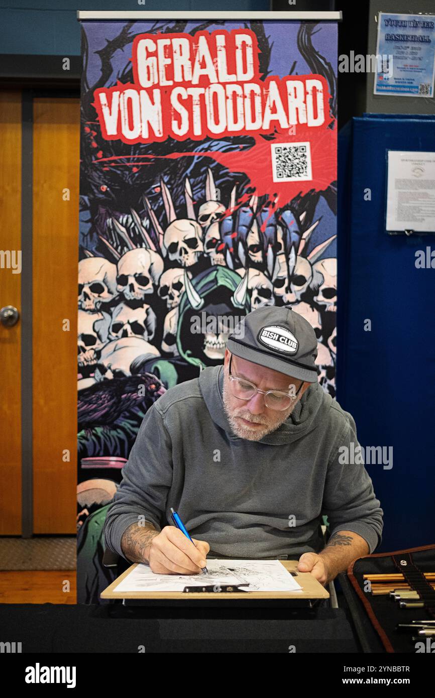 Gerald Von Stoddard, a comic book artist and writer sketching at the ...