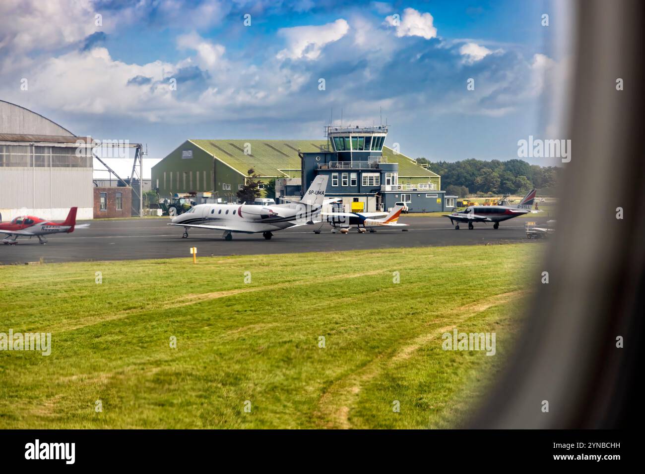 View of terminal buildings from plane window at Teesside International ...