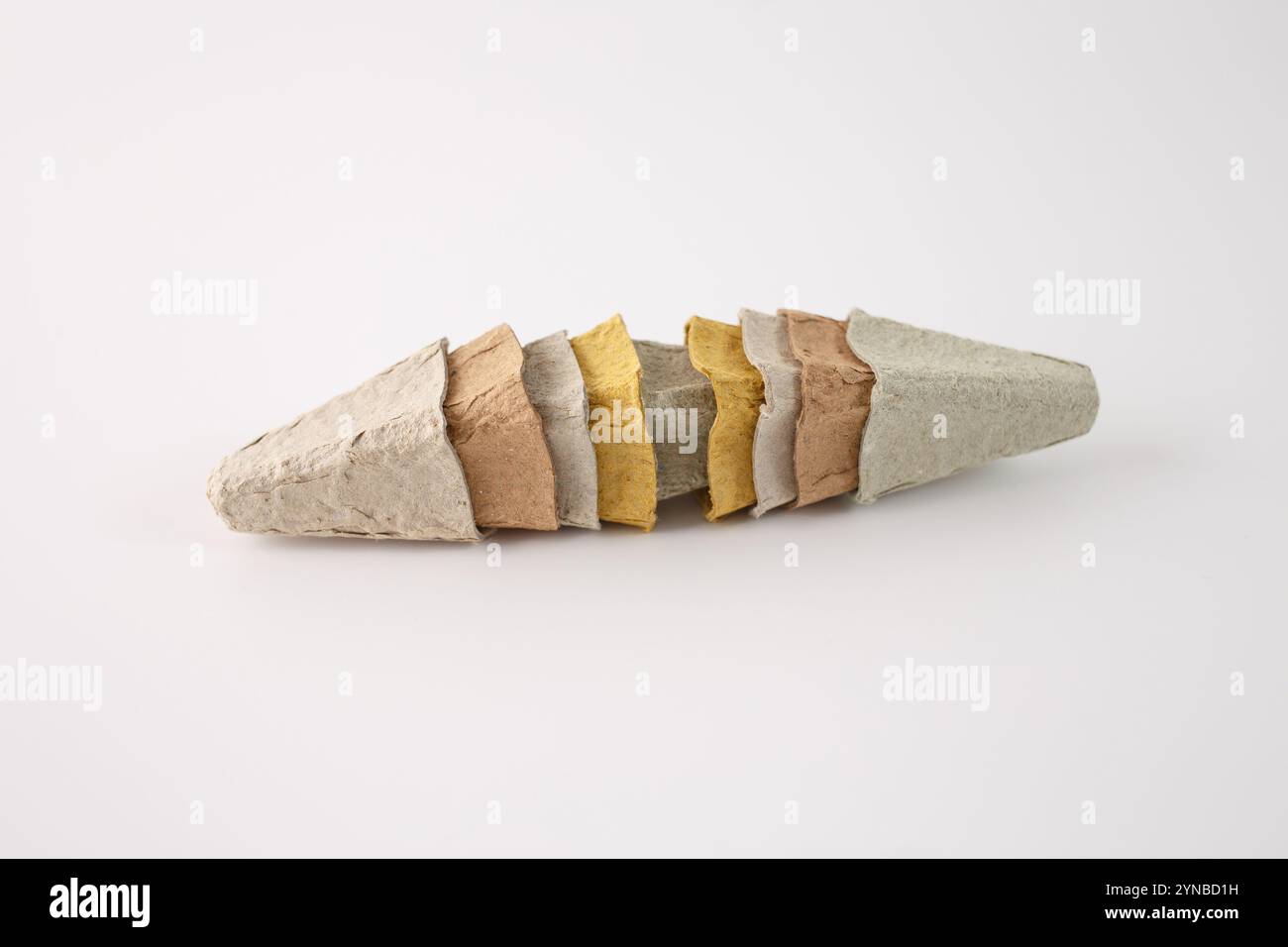 a series of cone-shaped objects made from a rough, fibrous material ...