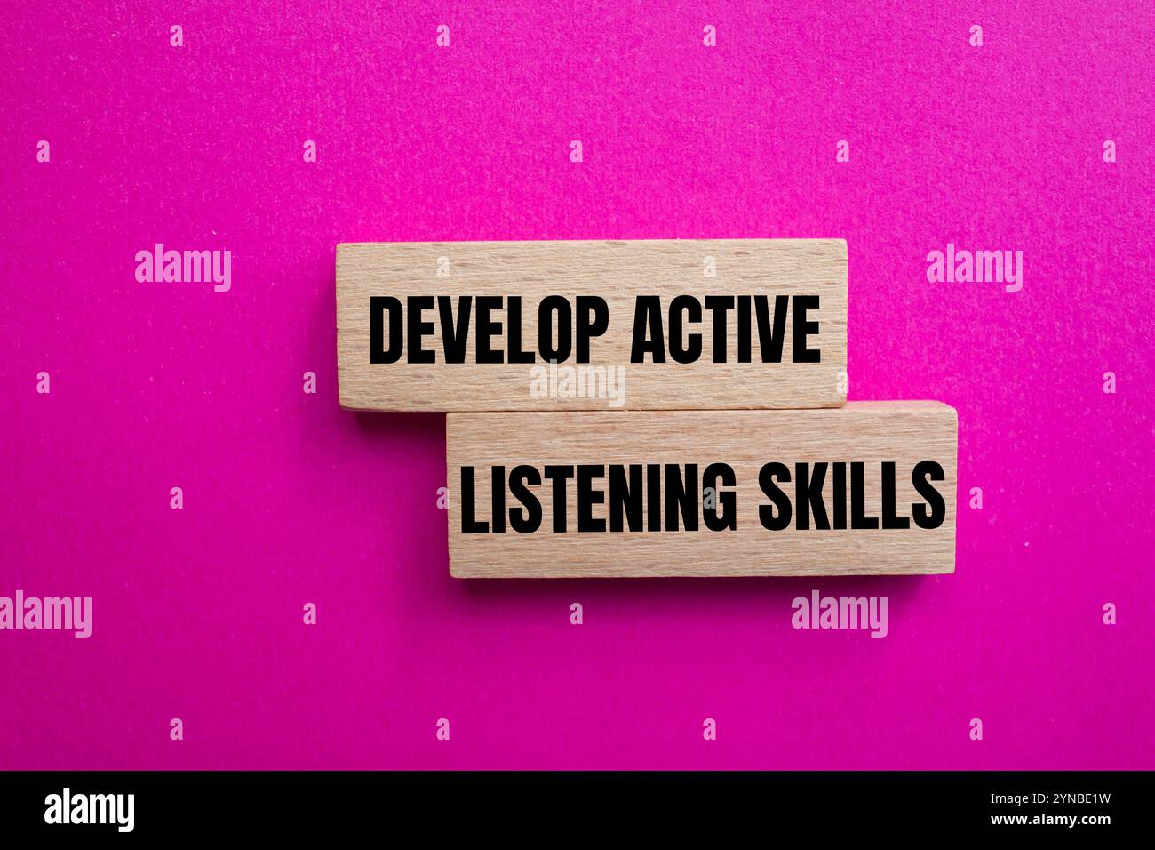 Develop active listening skills message written on wooden blocks with ...