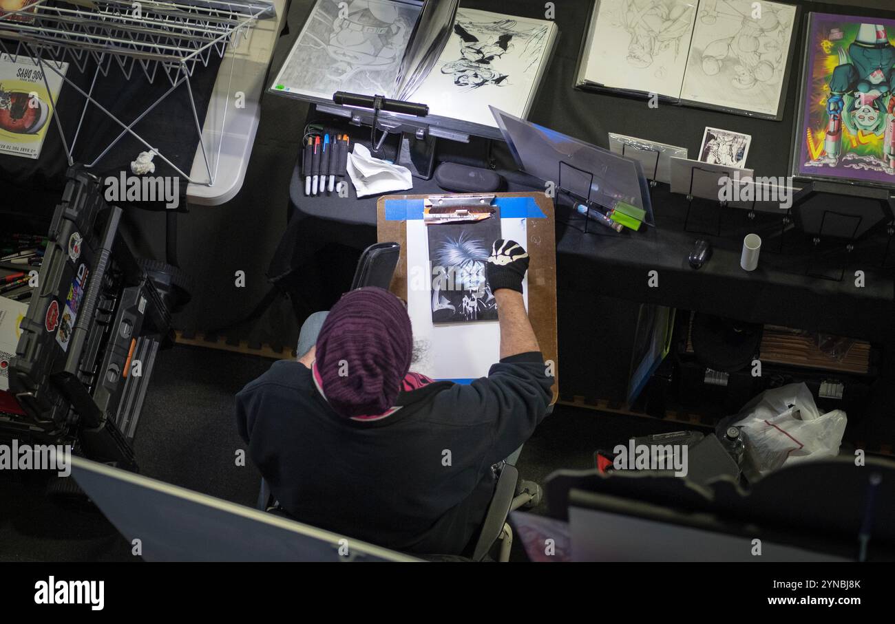 A view from above of an anonymous cartoon artist drawing a scary ...