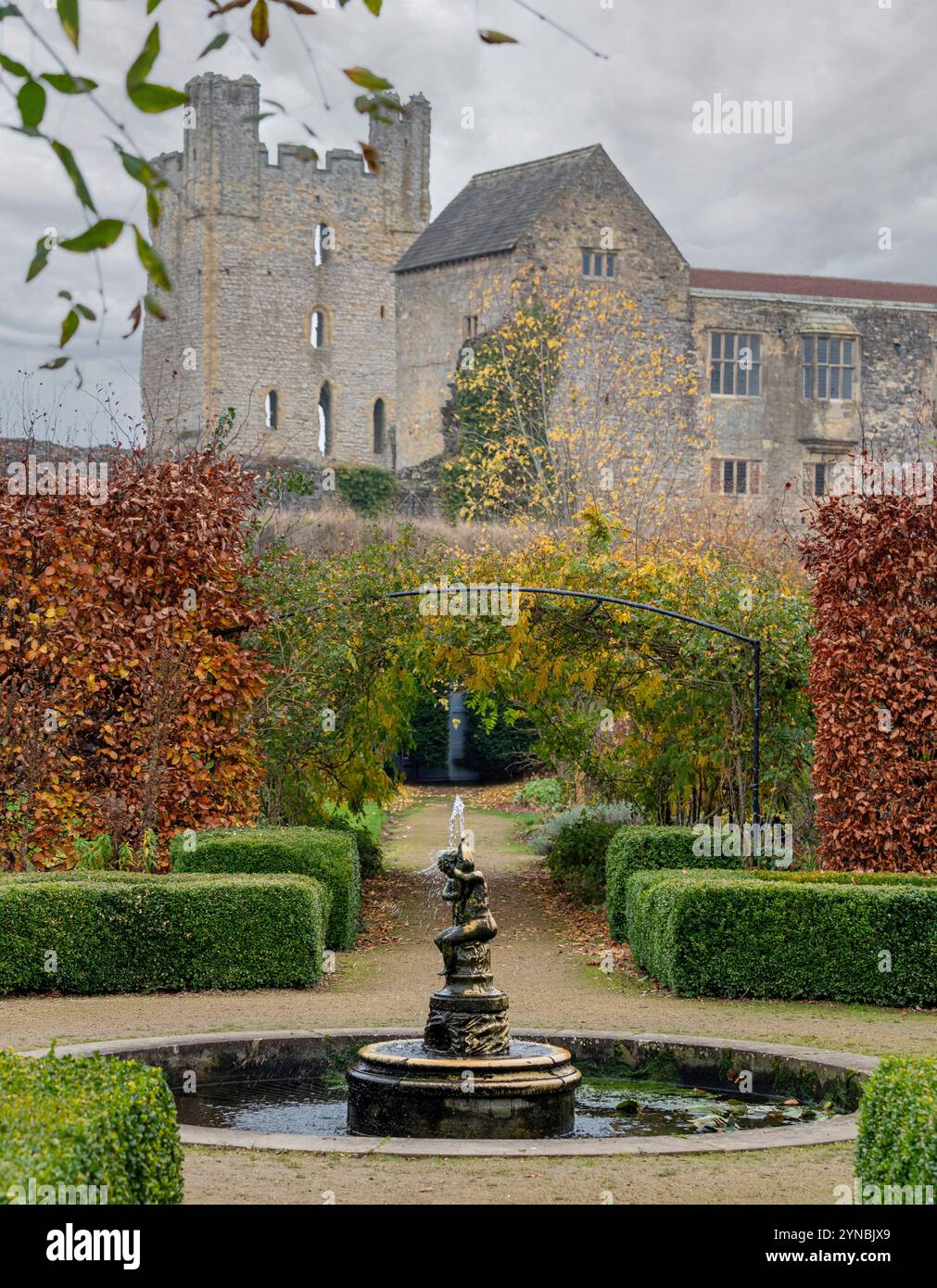 Fountain in Helmsley Walled Garden with a backdrop of Helmsley Castle ...