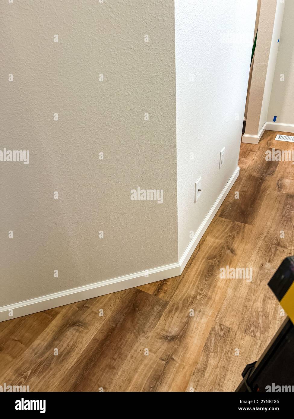 Installing Vinyl Floors and PVC Baseboards Stock Photo - Alamy