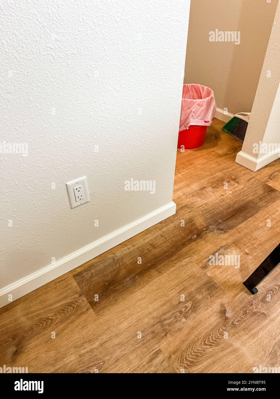 Installing Vinyl Floors and PVC Baseboards Stock Photo - Alamy