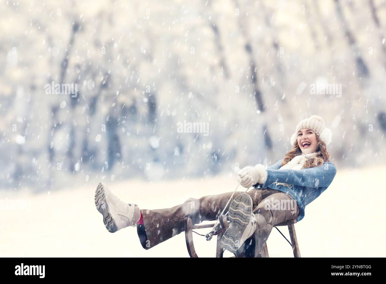 Christmas sledding joyful woman hi-res stock photography and images - Alamy