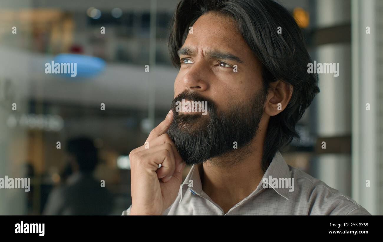 Stressed frustrated Indian man in underground parking lot suffering ...