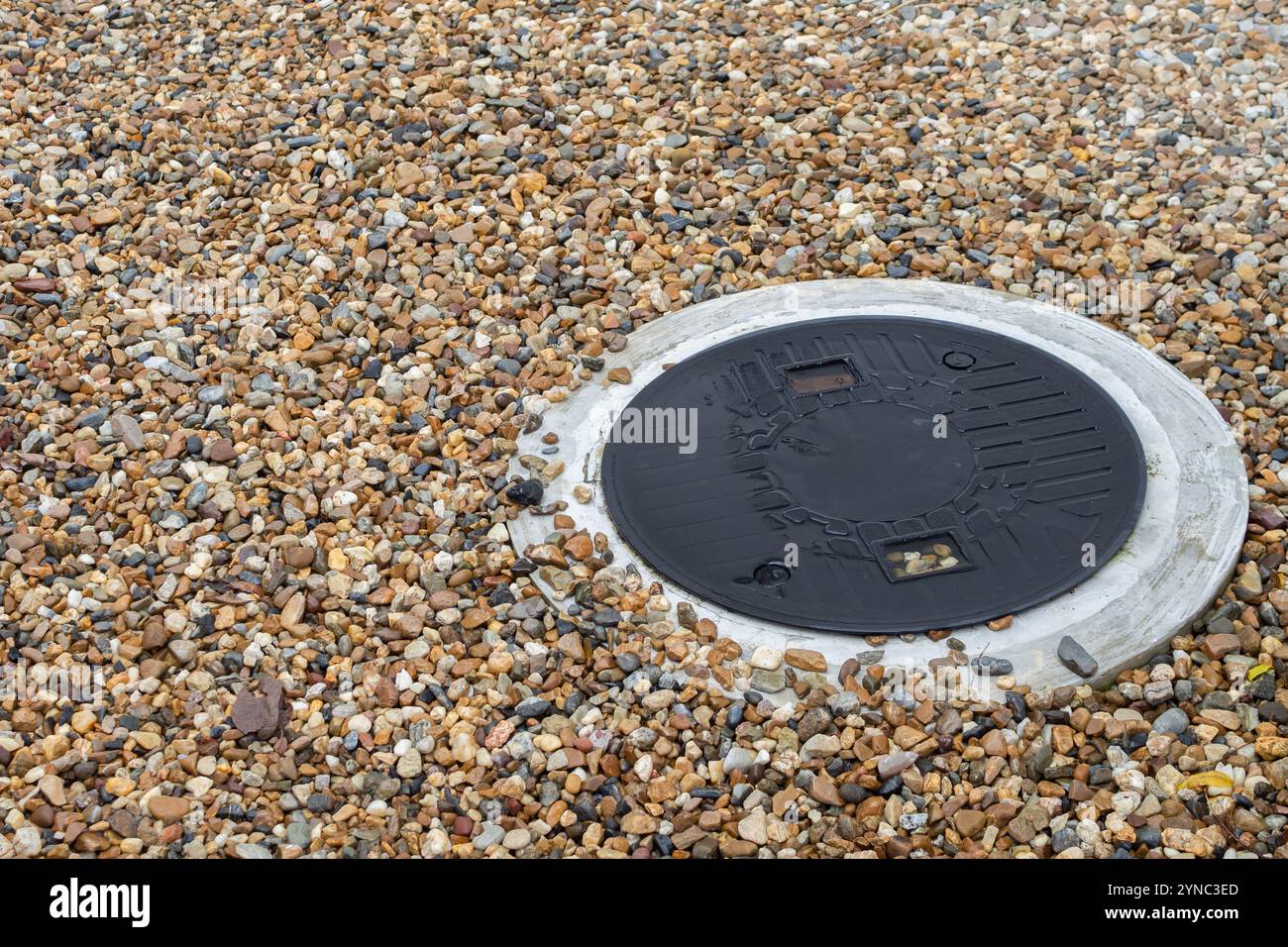 Septic tank cover underground waste treatment system Stock Photo - Alamy