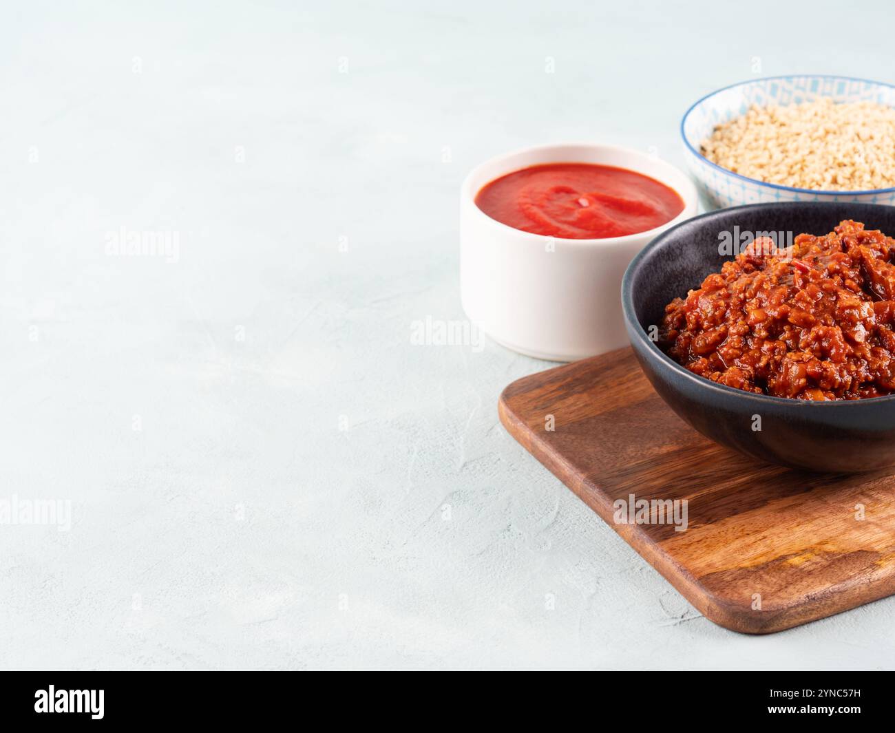 Vegan tomato bolognese ragu with soya protein granules in bowl Stock ...