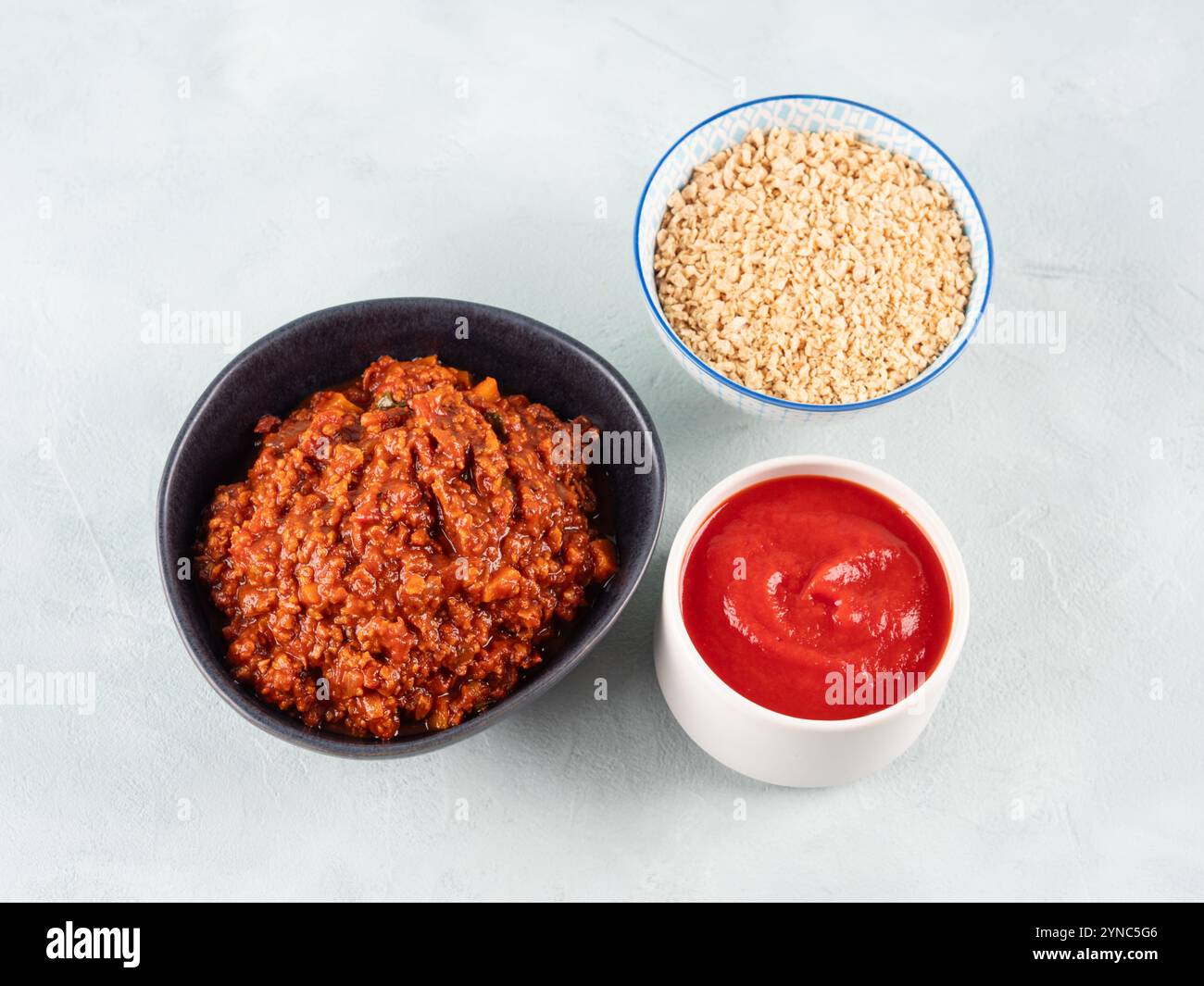 Vegan tomato bolognese ragu with soya protein granules in bowl Stock ...