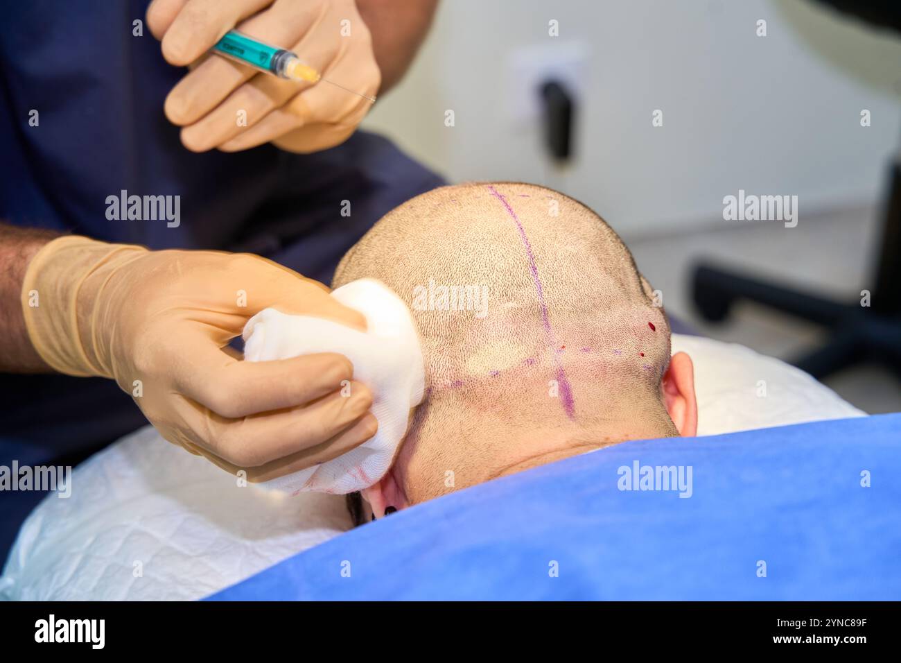 Healthcare professional administering injection hi-res stock ...