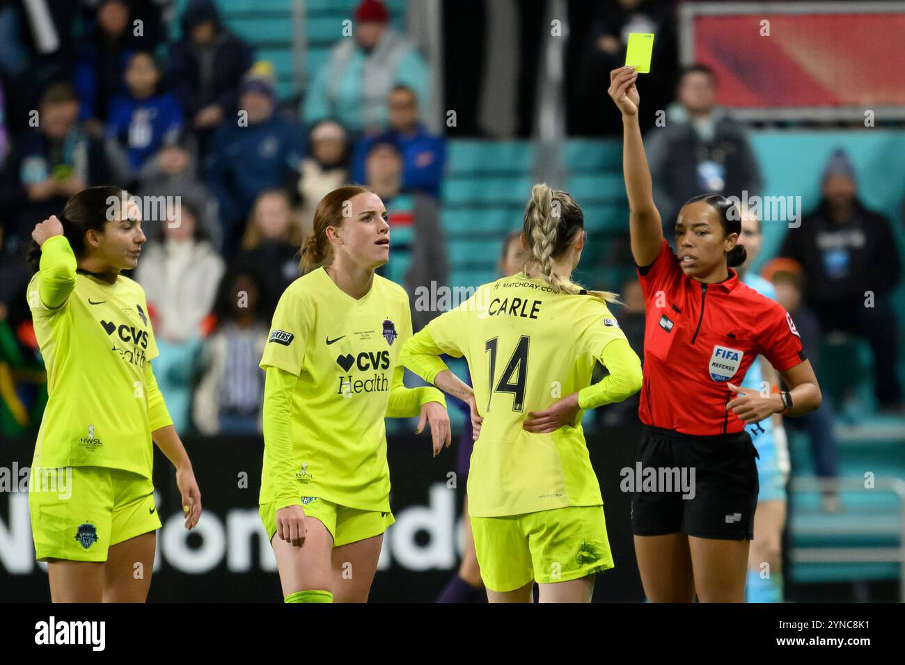 Washington Spirit defender Gabby Carle (14) is given a yellow card ...