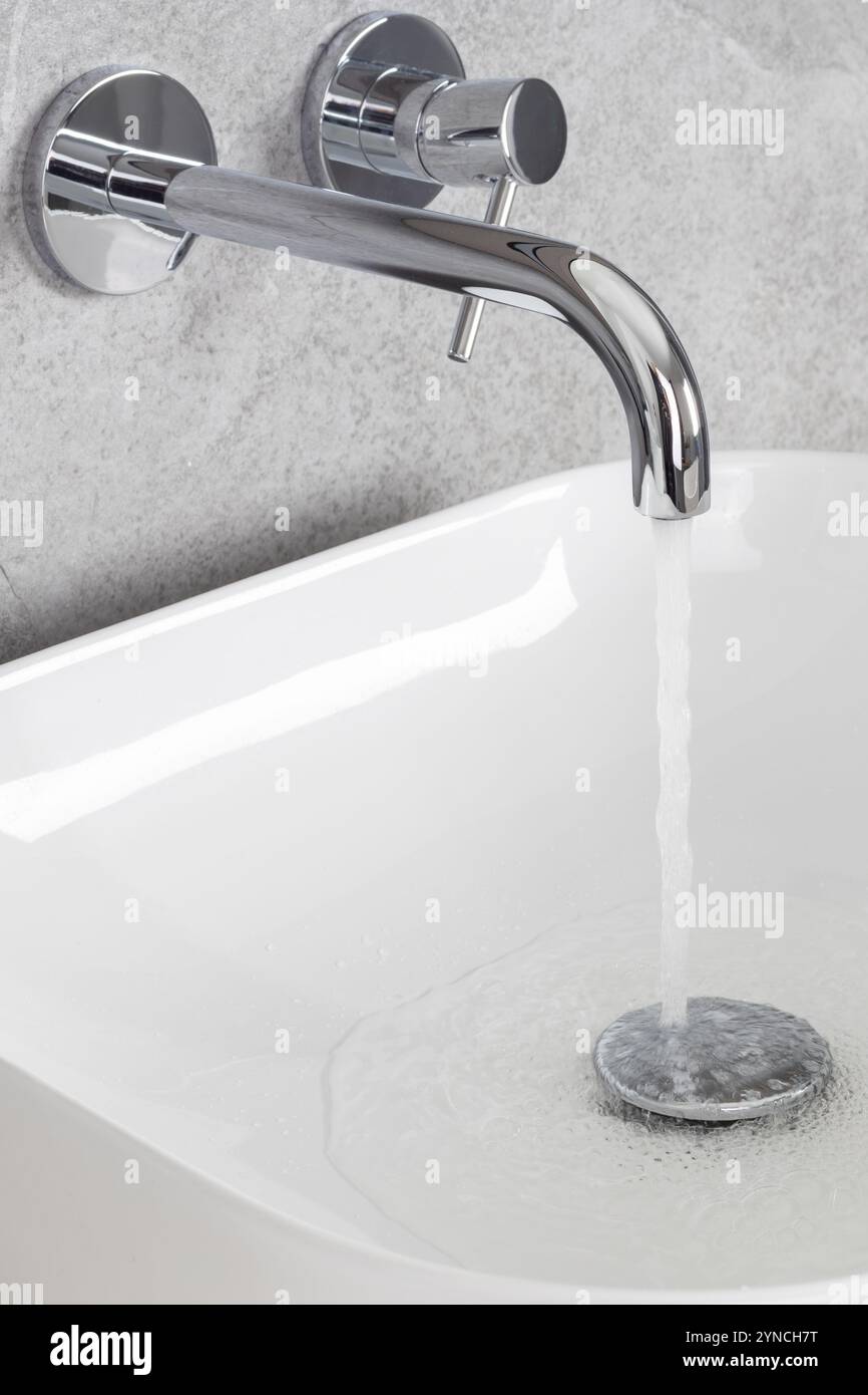 Sleek modern faucet water flowing hi-res stock photography and images ...