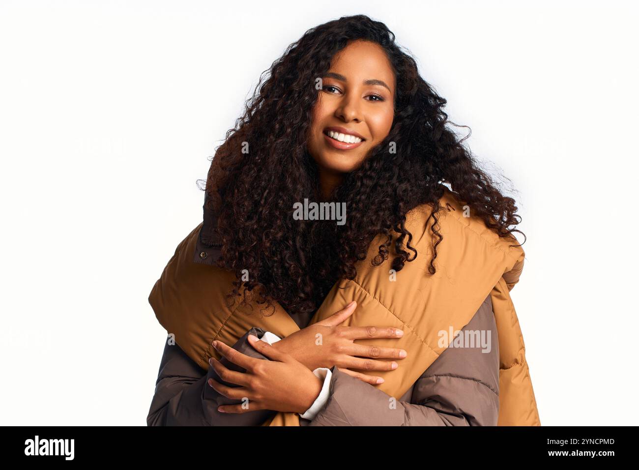 A beautiful woman exudes confidence while showcasing her cozy outfit ...