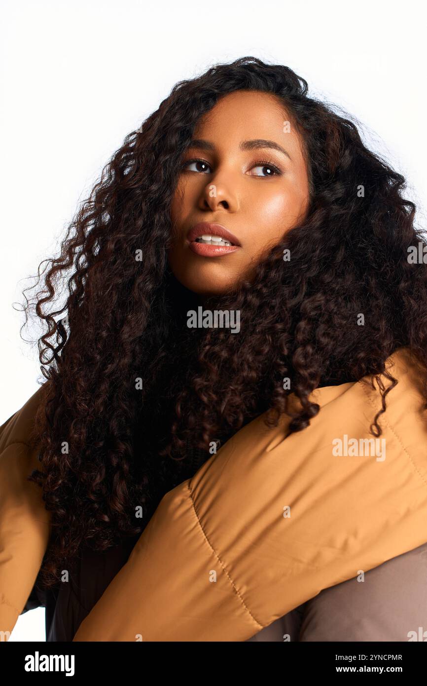 A beautiful woman exudes confidence while showcasing her unique style ...