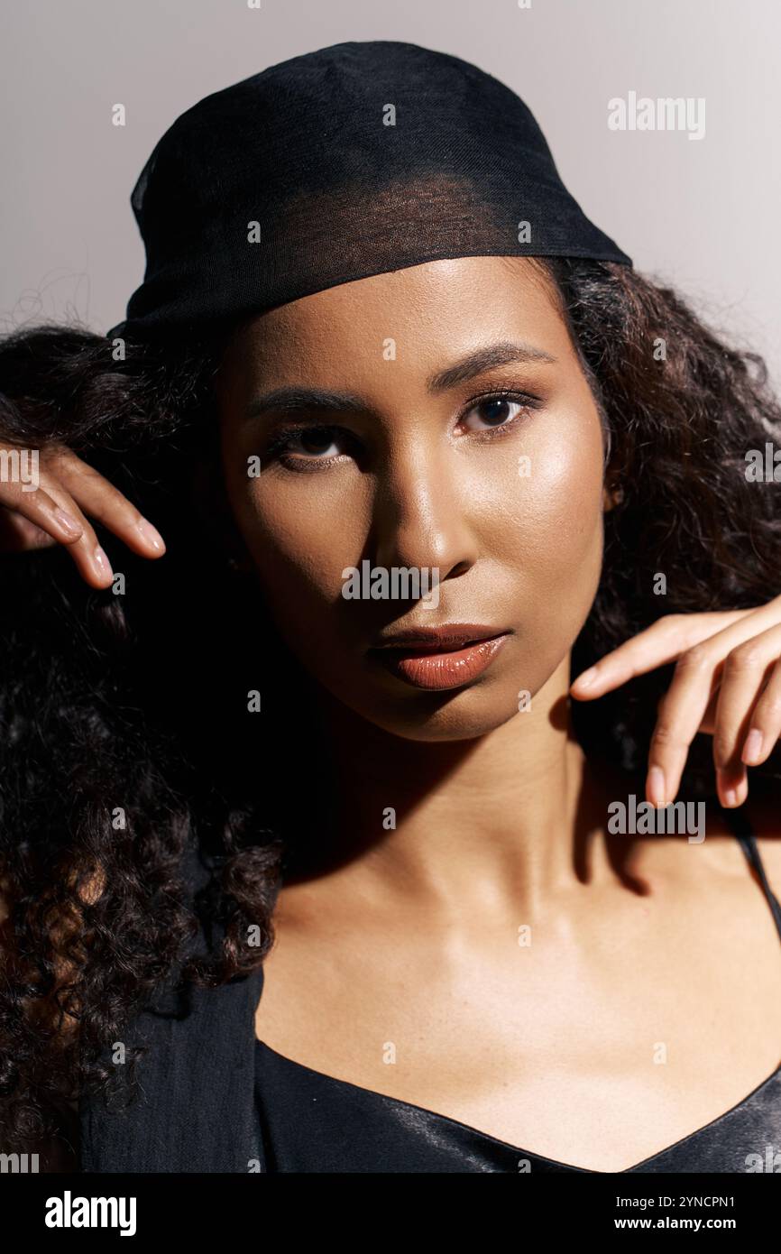 Strikingly beautiful woman poses gracefully, showcasing her natural ...