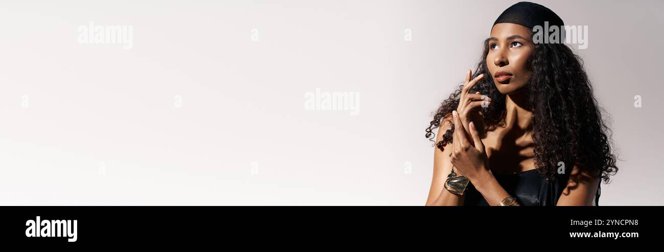 A talented woman poses gracefully, exuding charm and elegance in her ...