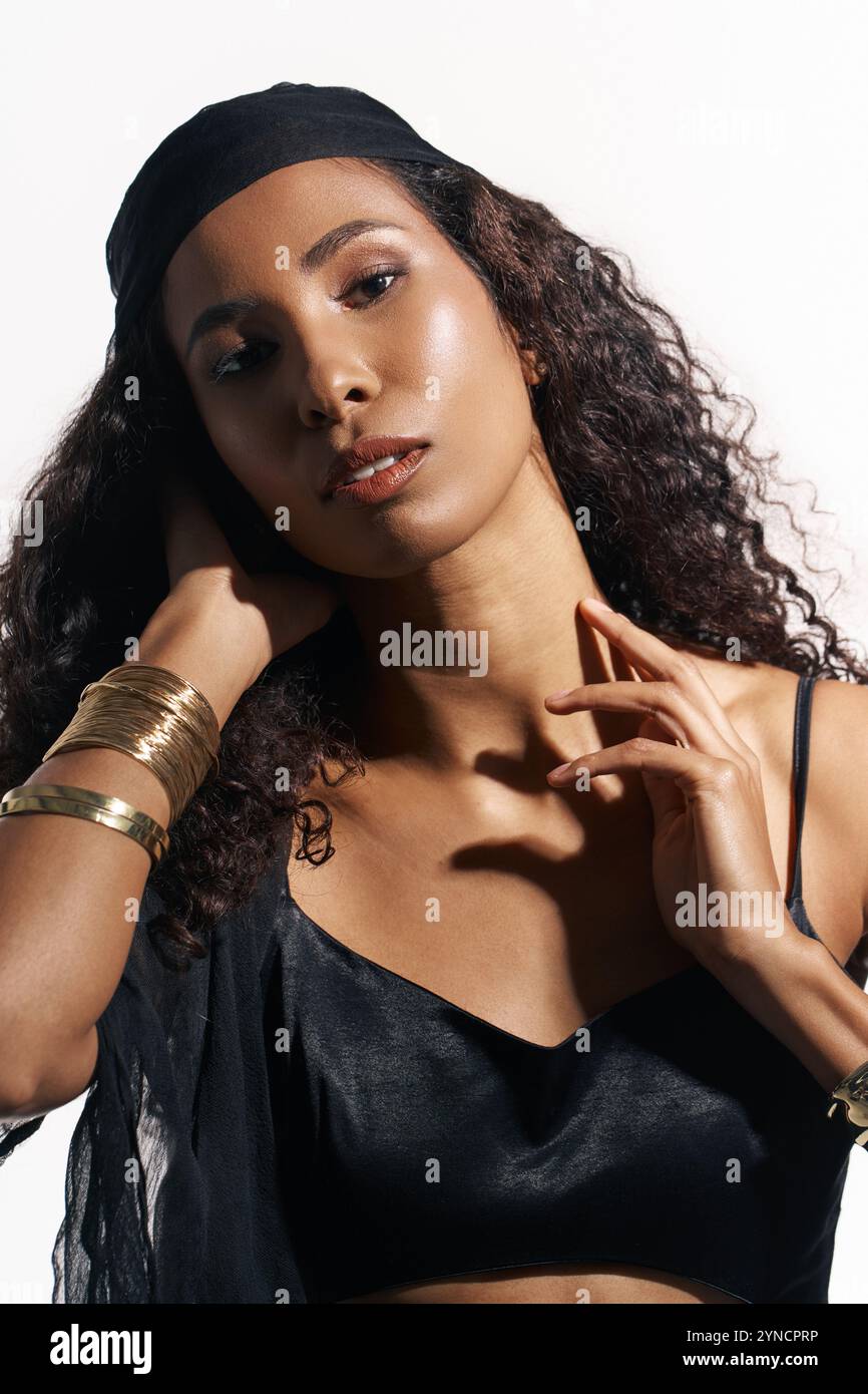 A stunning woman poses gracefully, showcasing her beauty and poise in a ...