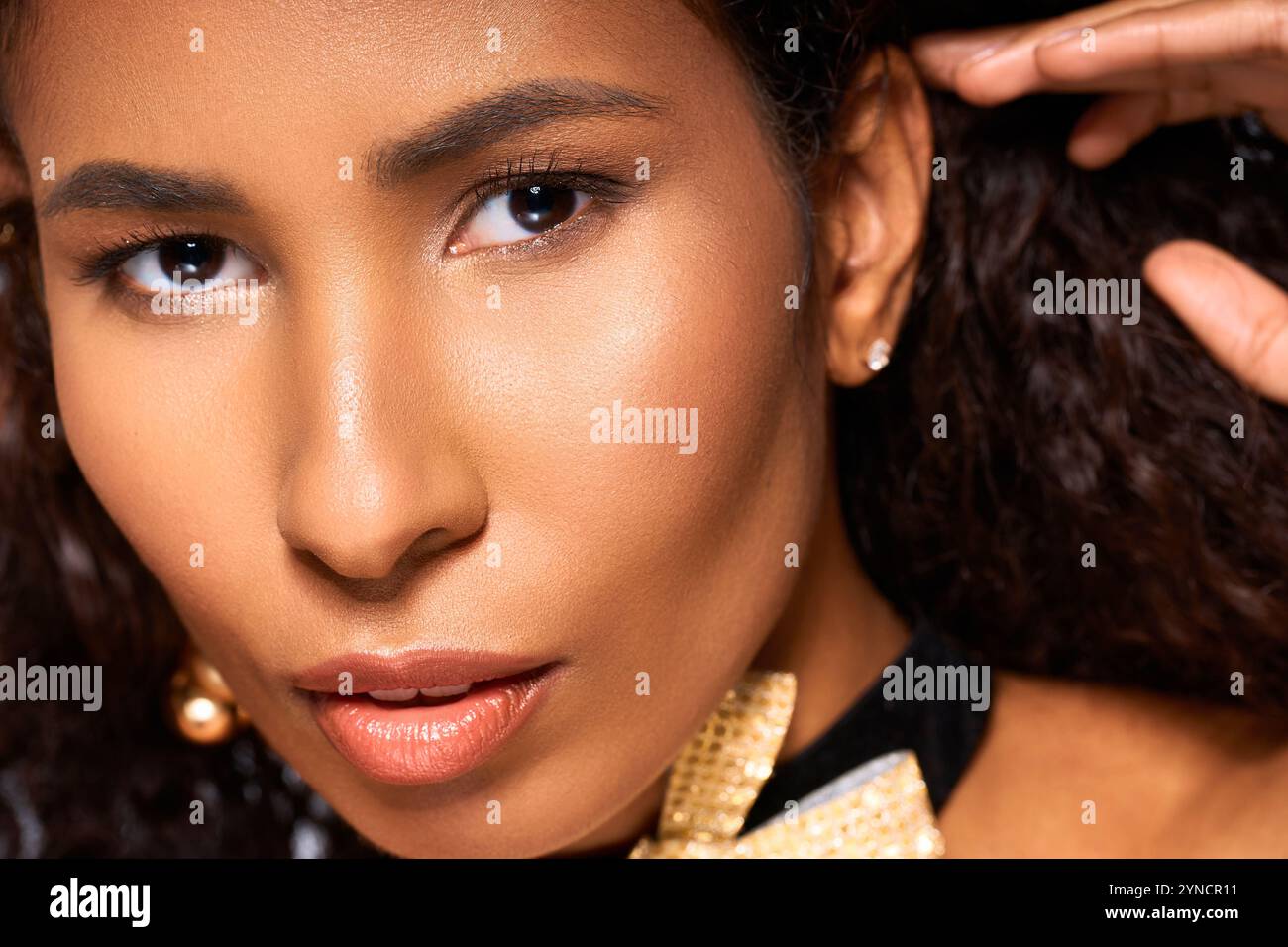 A striking woman captivates with her beauty, intense gaze, and refined ...