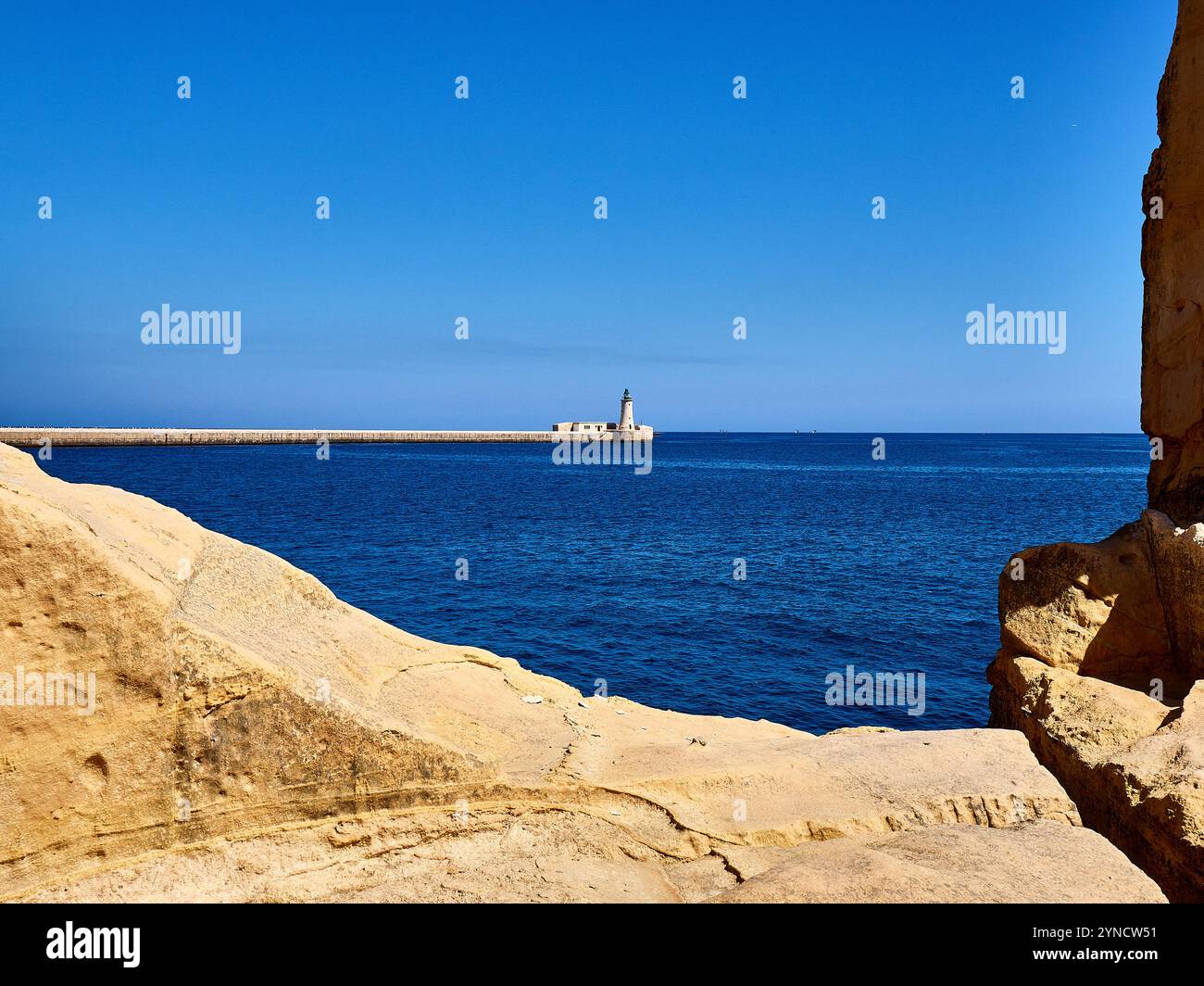 View of the lighthouse at the entrance to the port of Valletta, Malta ...