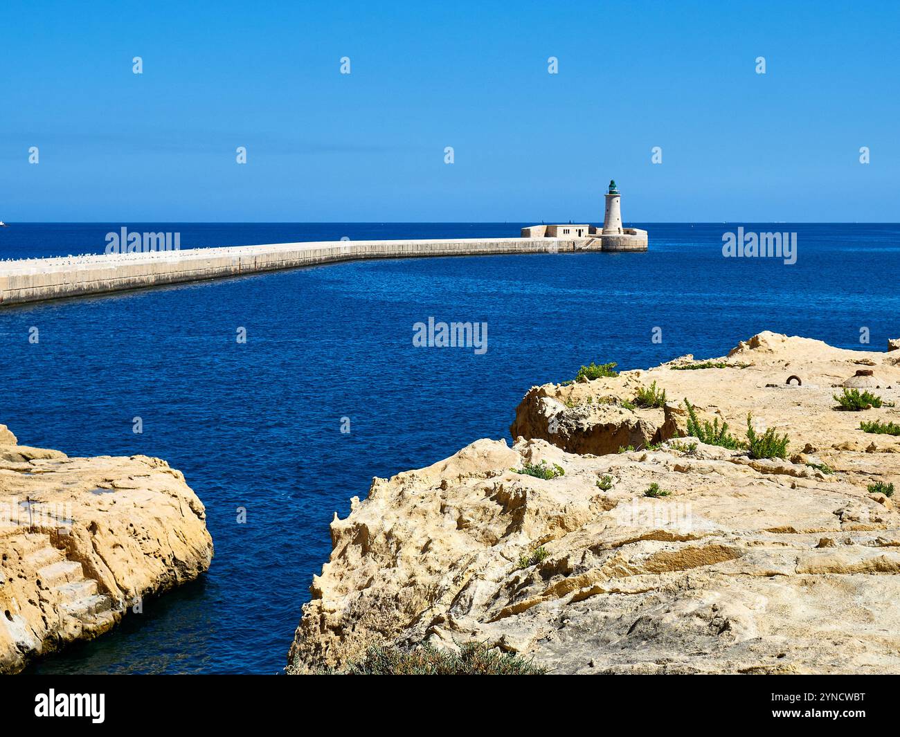 View of the lighthouse at the entrance to the port of Valletta, Malta ...