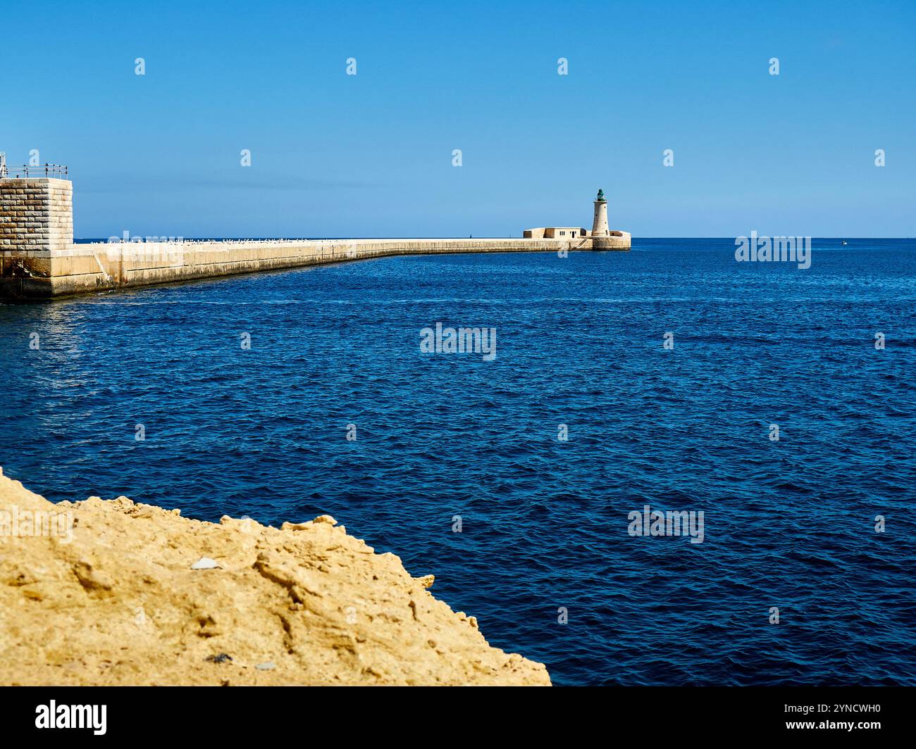 View of the lighthouse at the entrance to the port of Valletta, Malta ...